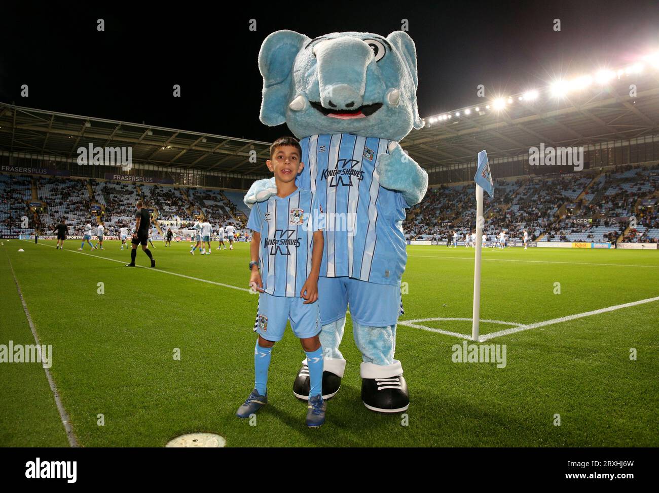 Coventry City mascot Sky Blue Sam poses for a photo with a matchday ...
