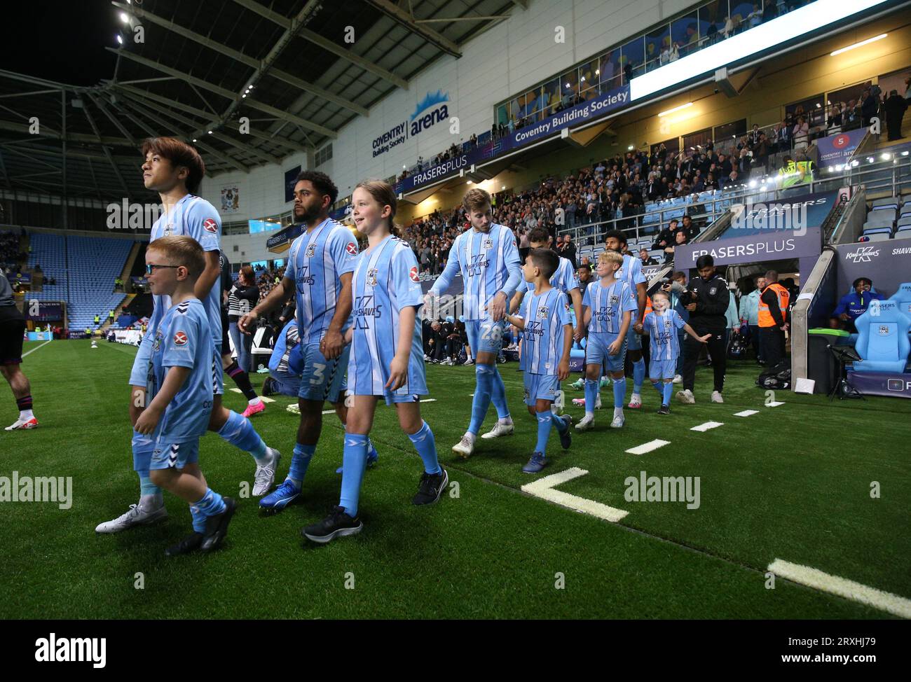 Coventry City matchday mascots walk out with the players before the Sky ...