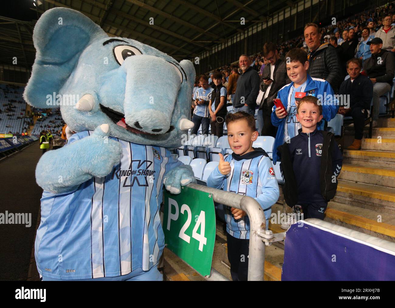 Coventry City mascot Sky Blue Sam poses for a photo with fans at half ...