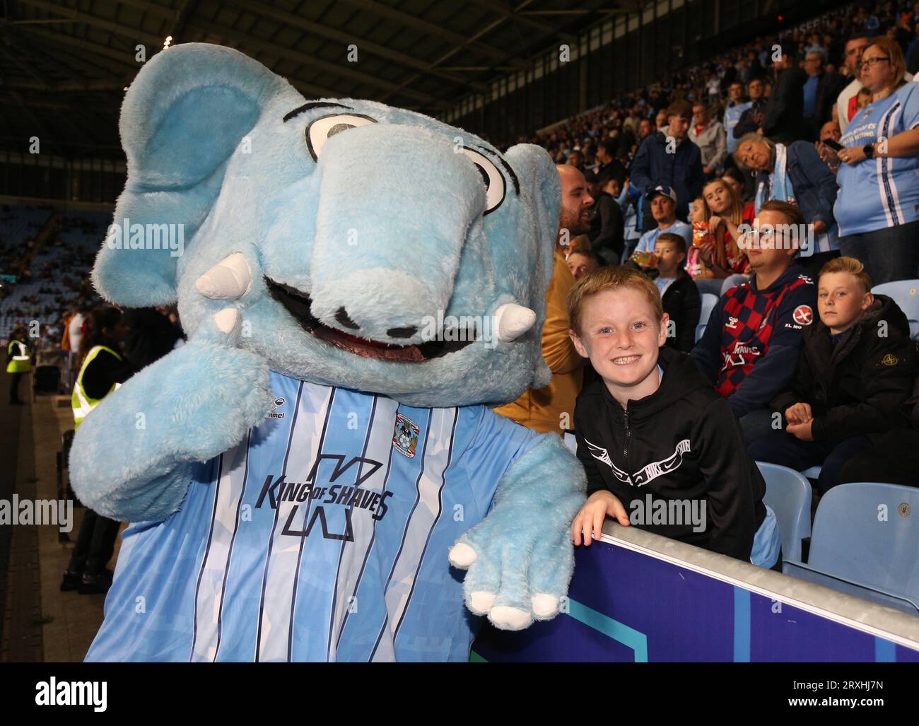 Coventry City mascot Sky Blue Sam poses for a photo with fans at half ...