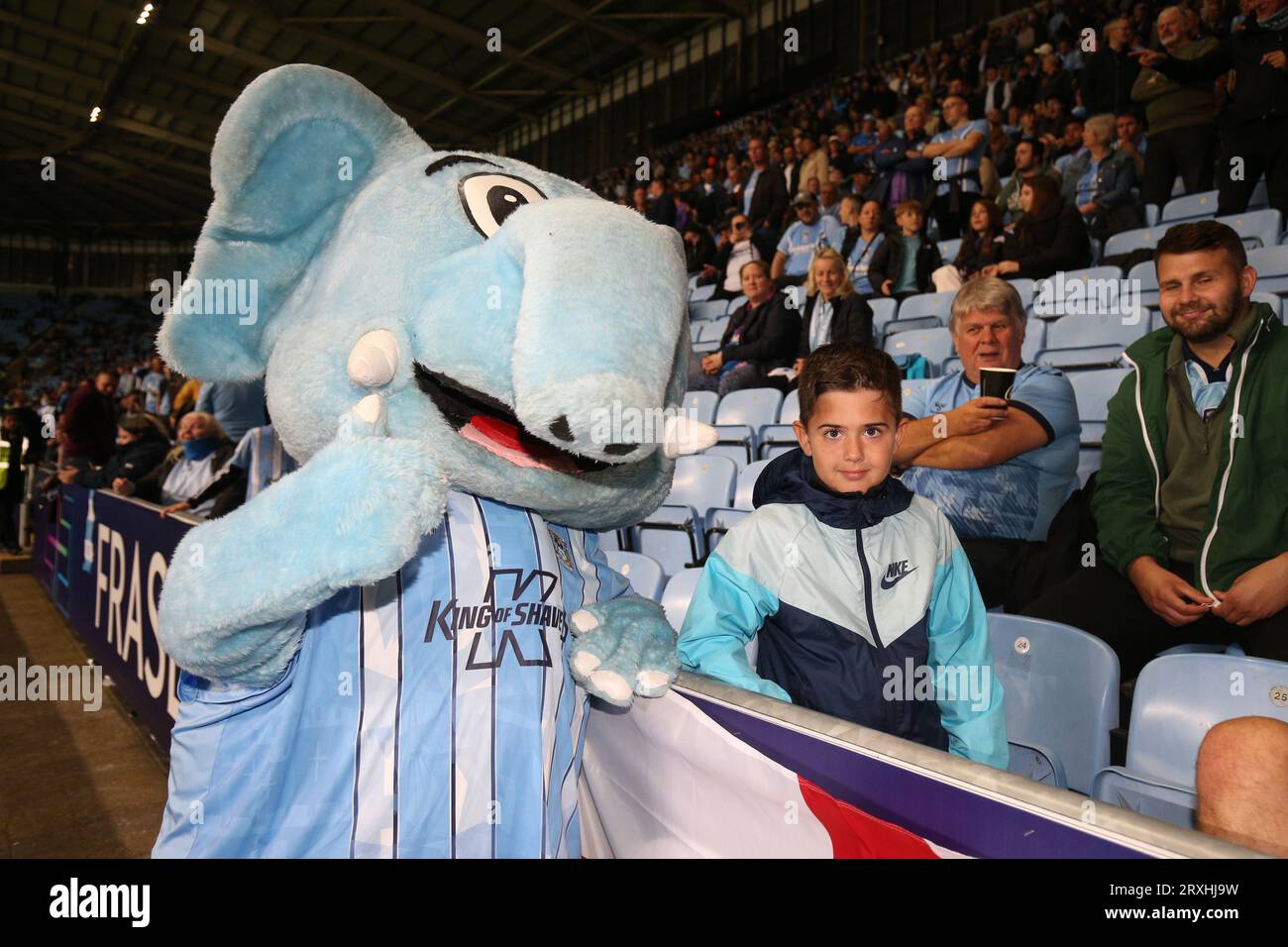 Coventry City mascot Sky Blue Sam poses for a photo with fans at half ...