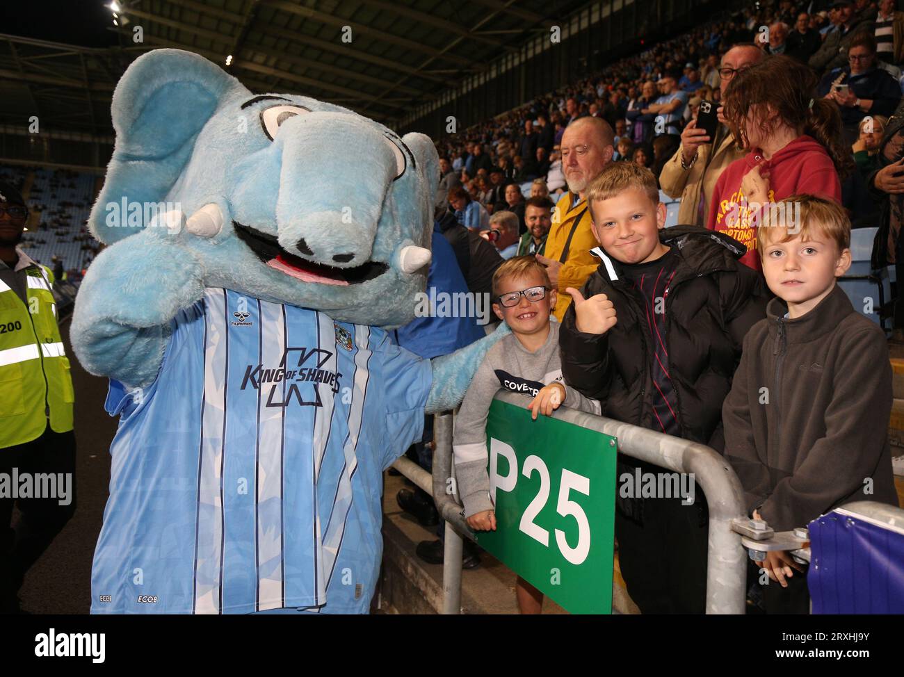 Coventry City mascot Sky Blue Sam poses for a photo with fans at half ...