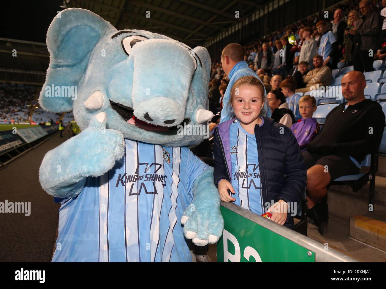 Coventry City mascot Sky Blue Sam poses for a photo with fans at half ...