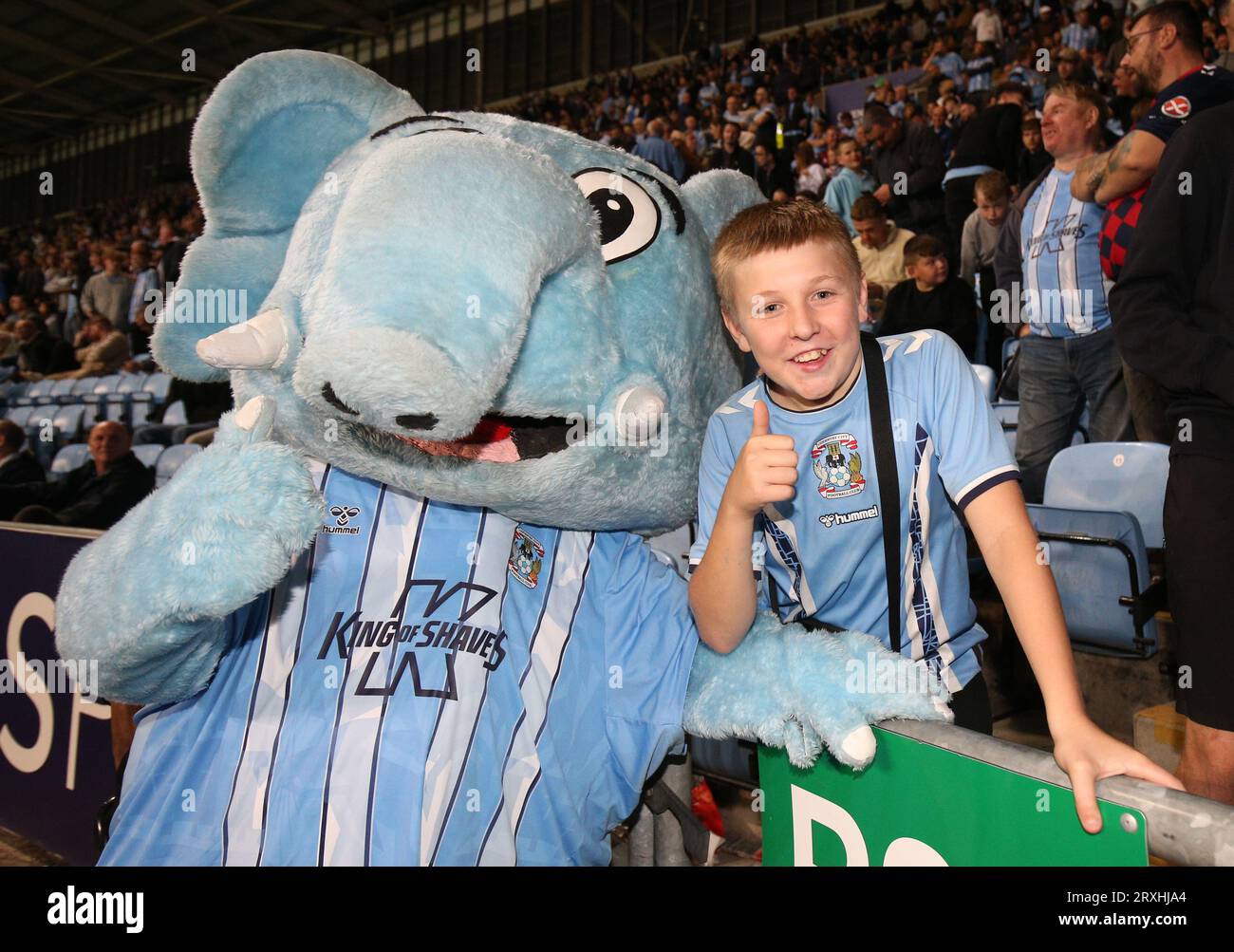 Coventry City mascot Sky Blue Sam poses for a photo with fans at half ...