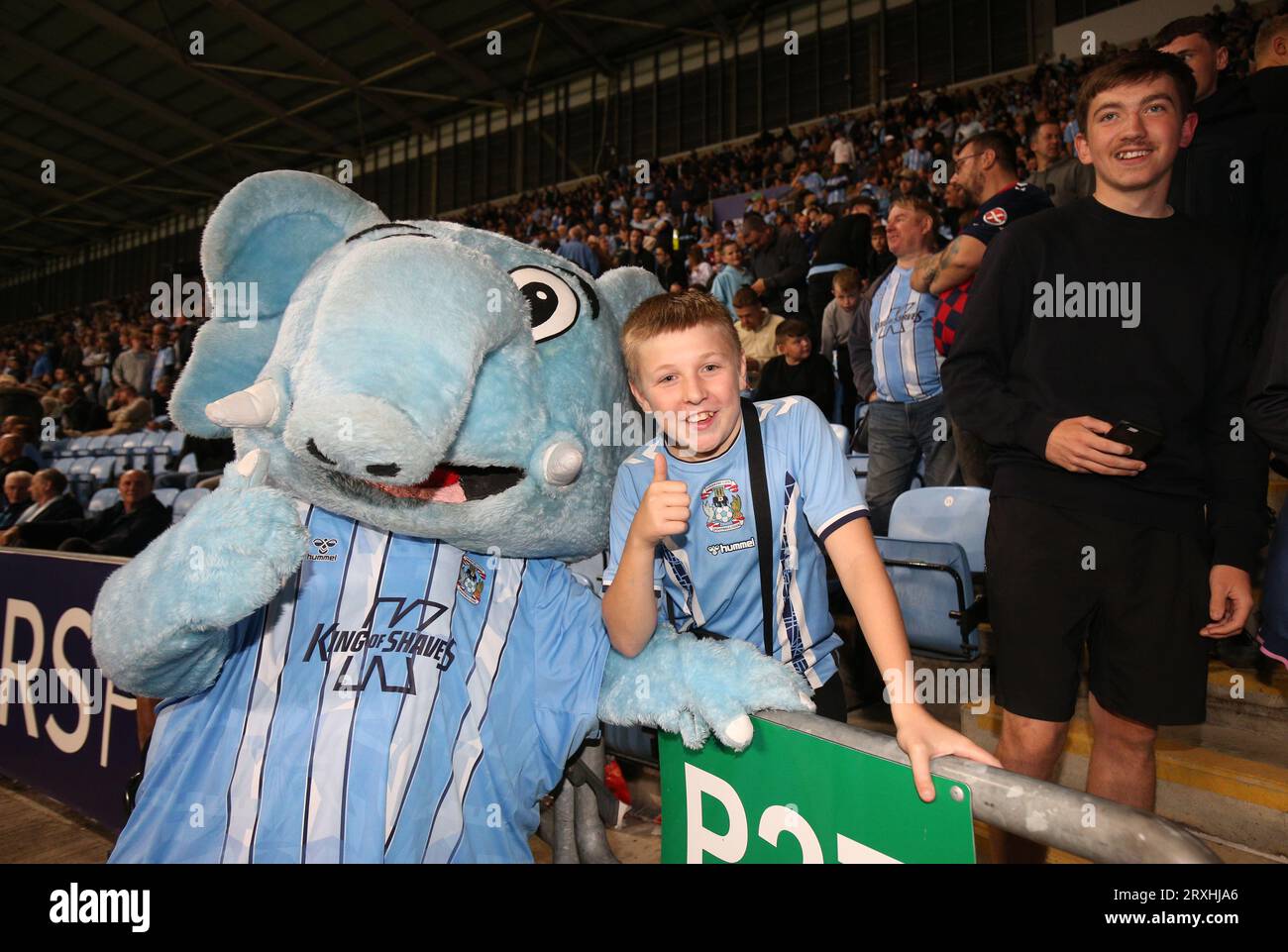 Coventry City mascot Sky Blue Sam poses for a photo with fans at half ...