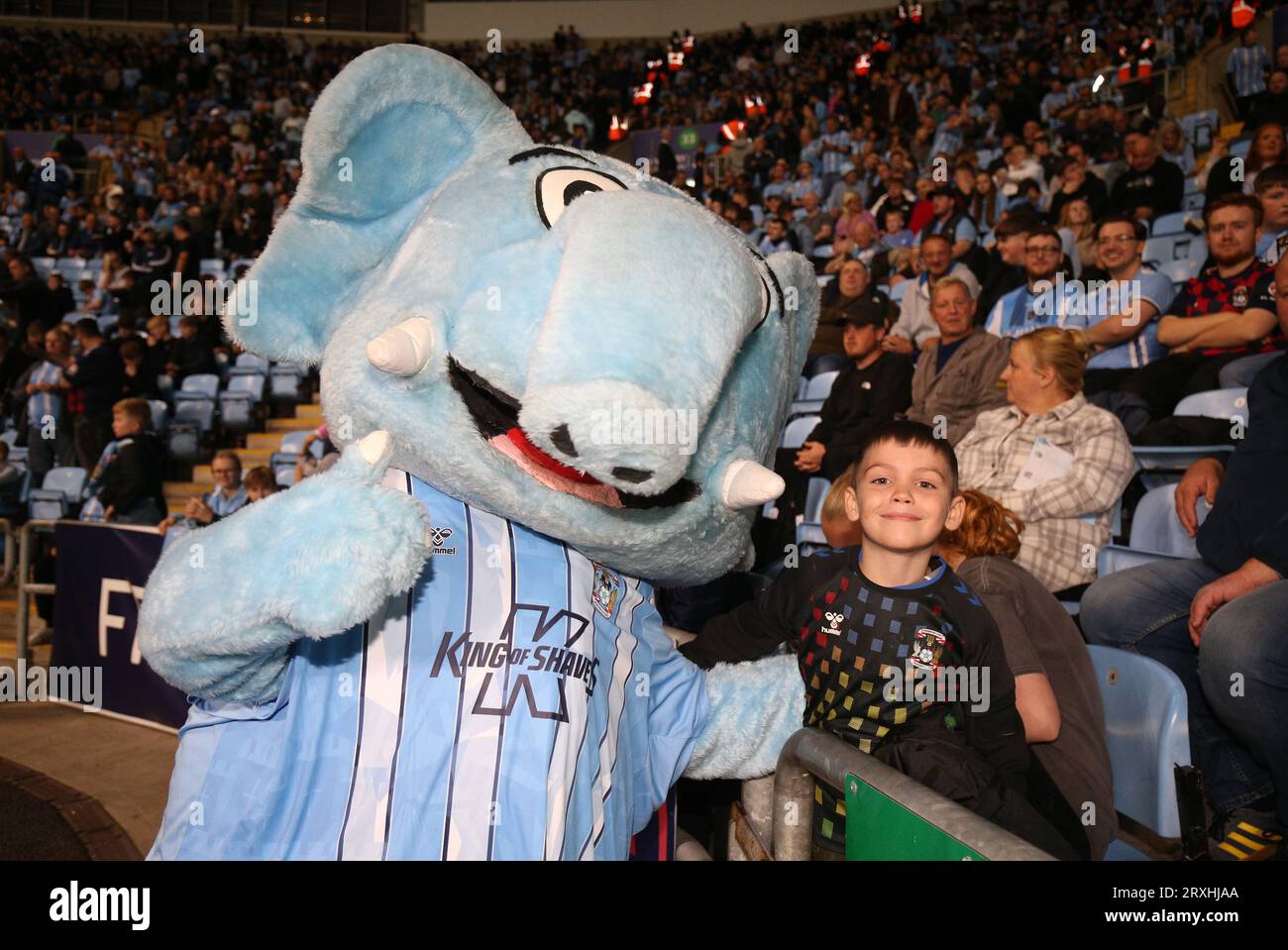 Coventry City mascot Sky Blue Sam poses for a photo with fans at half ...
