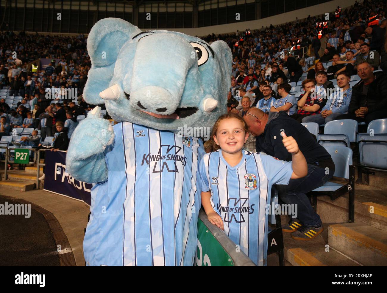Coventry City mascot Sky Blue Sam poses for a photo with fans at half ...