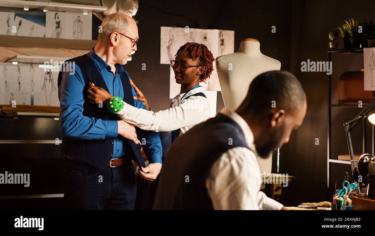 Old customer trying on suit hi-res stock photography and images - Alamy