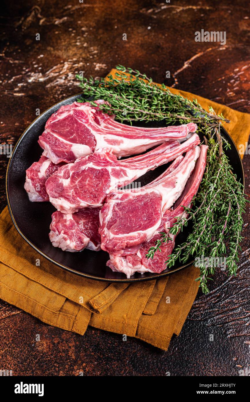 Raw lamb chops, fresh mutton meat cutlets on a ribs. Dark background. Top view Stock Photo - Alamy