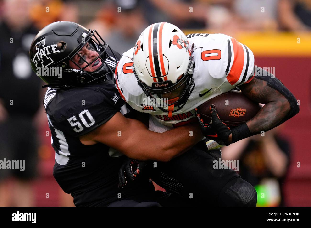 Iowa State linebacker Caleb Bacon (50) tackles Oklahoma State running ...