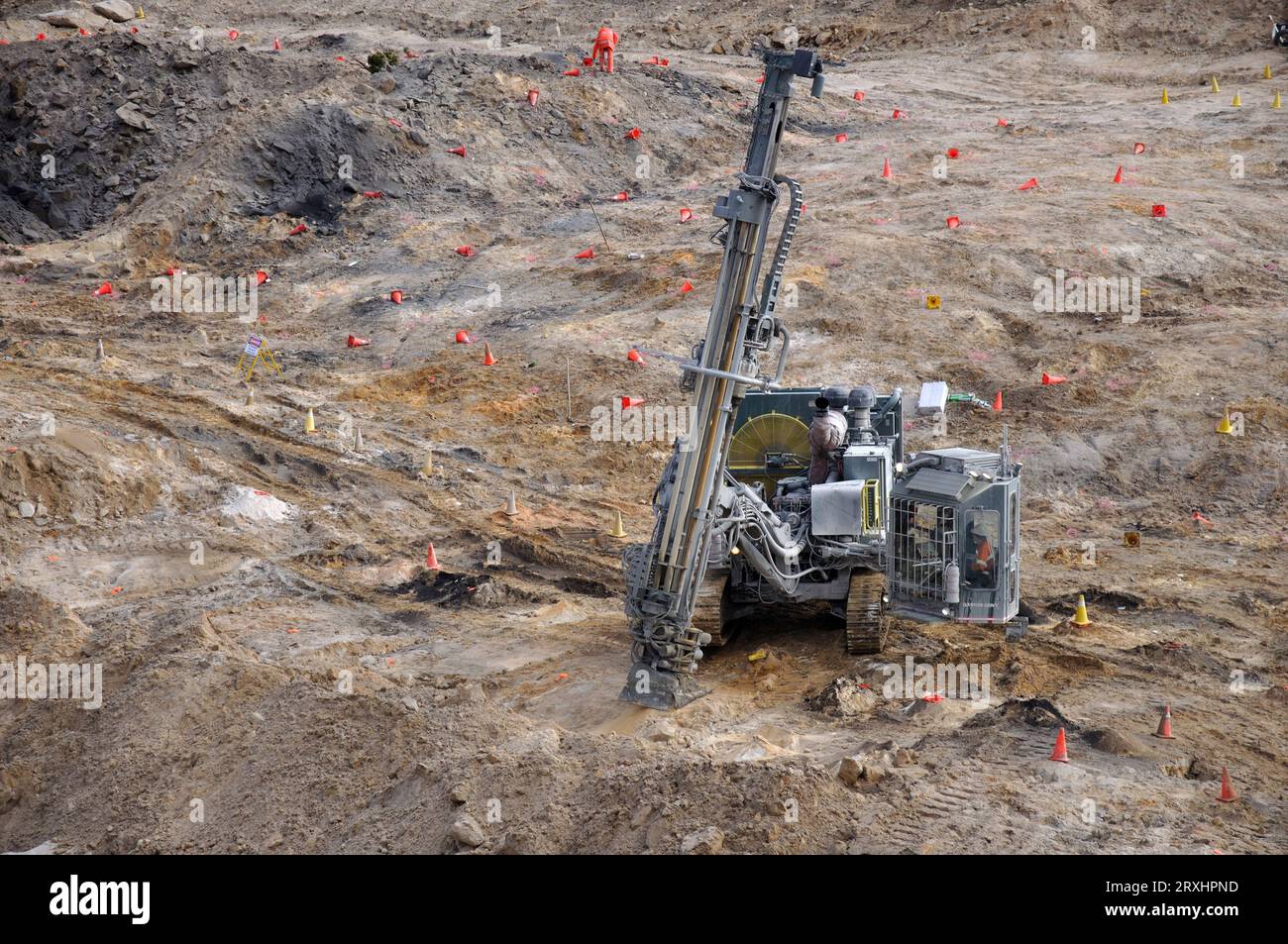 Drilling machine preparing for a blasting session at an open cast coal mine, Westland, New ...
