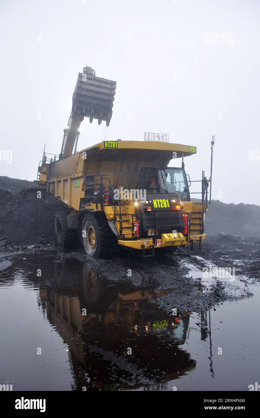 190 ton digger loading a 70 ton tiptruck at an open cast coal mine ...