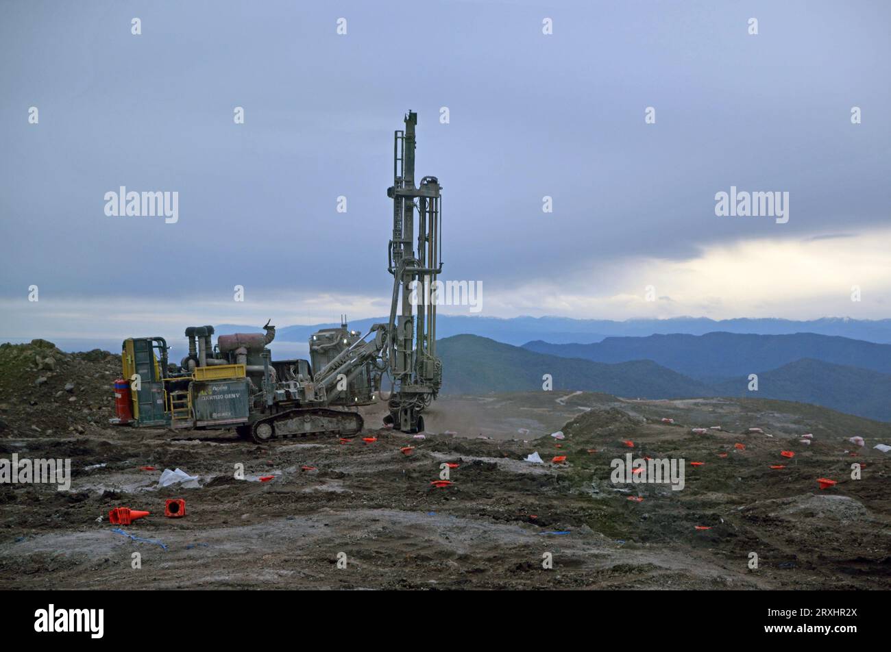 drilling rig prepares blasting holes to remove overburden at stockton coal mine, Westland, New ...