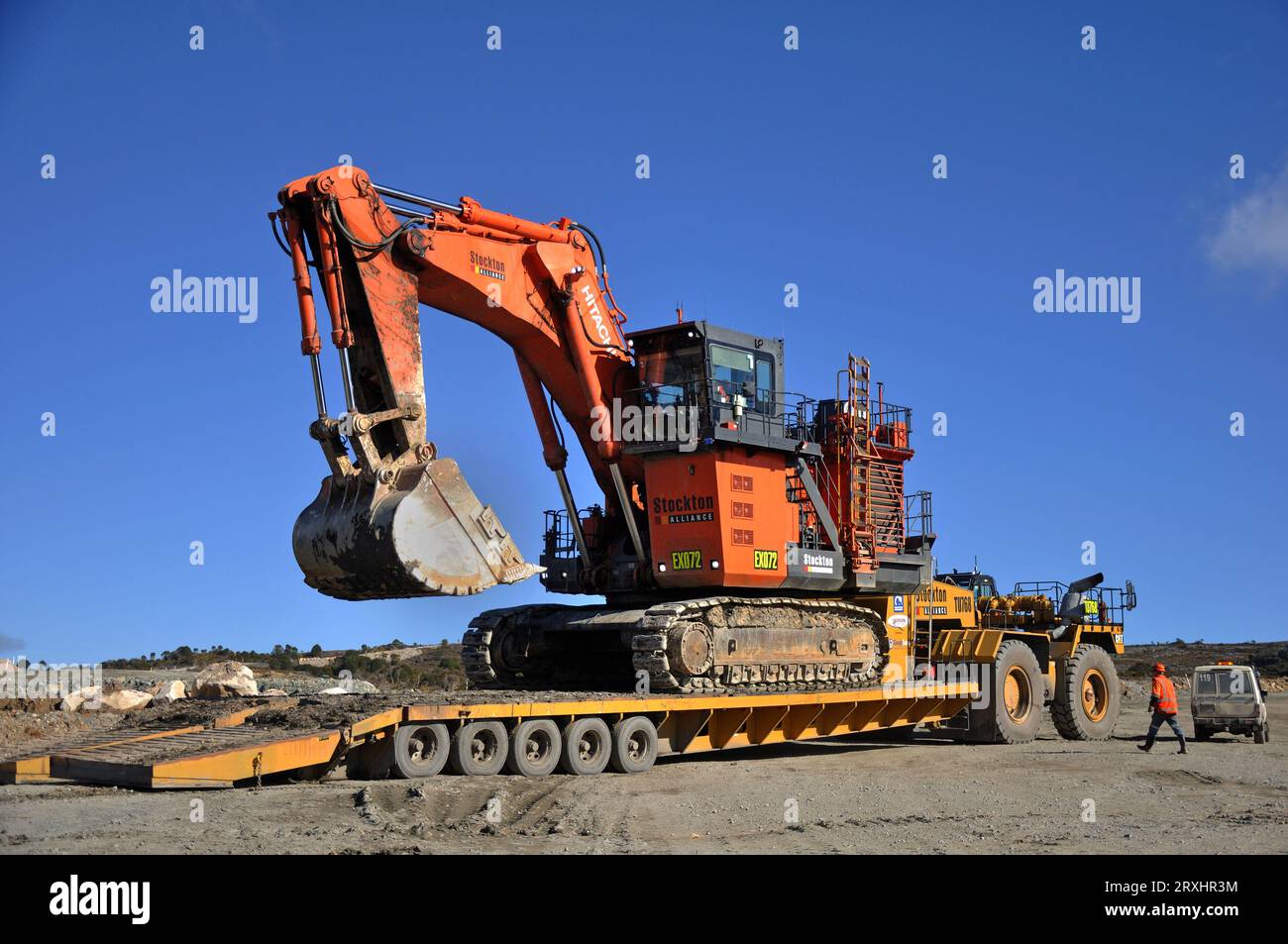 WESTPORT, NEW ZEALAND, AUGUST 31, 2013: Men load a 190 ton digger onto ...