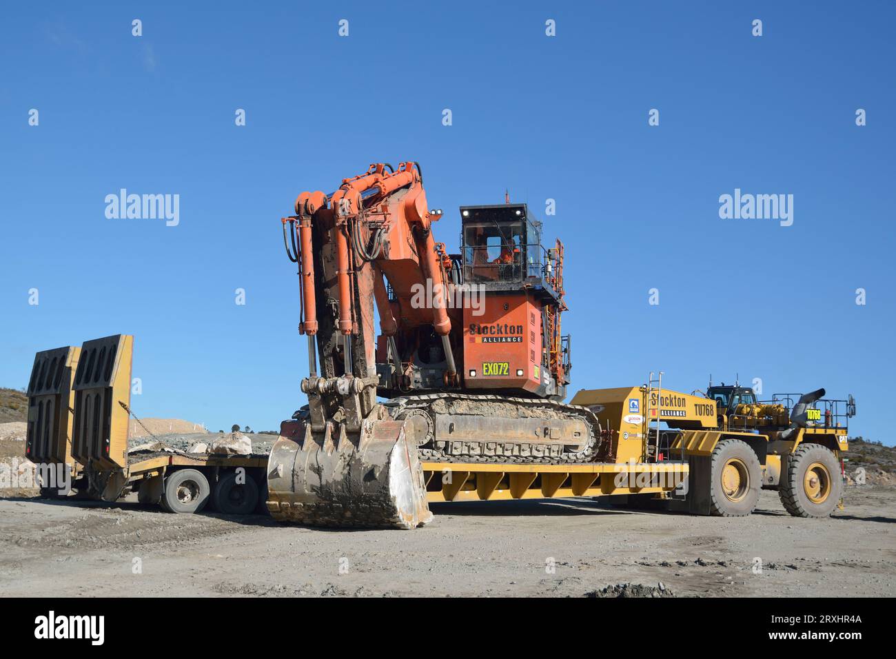 WESTPORT, NEW ZEALAND, AUGUST 31, 2013: Men load a 190 ton digger onto ...
