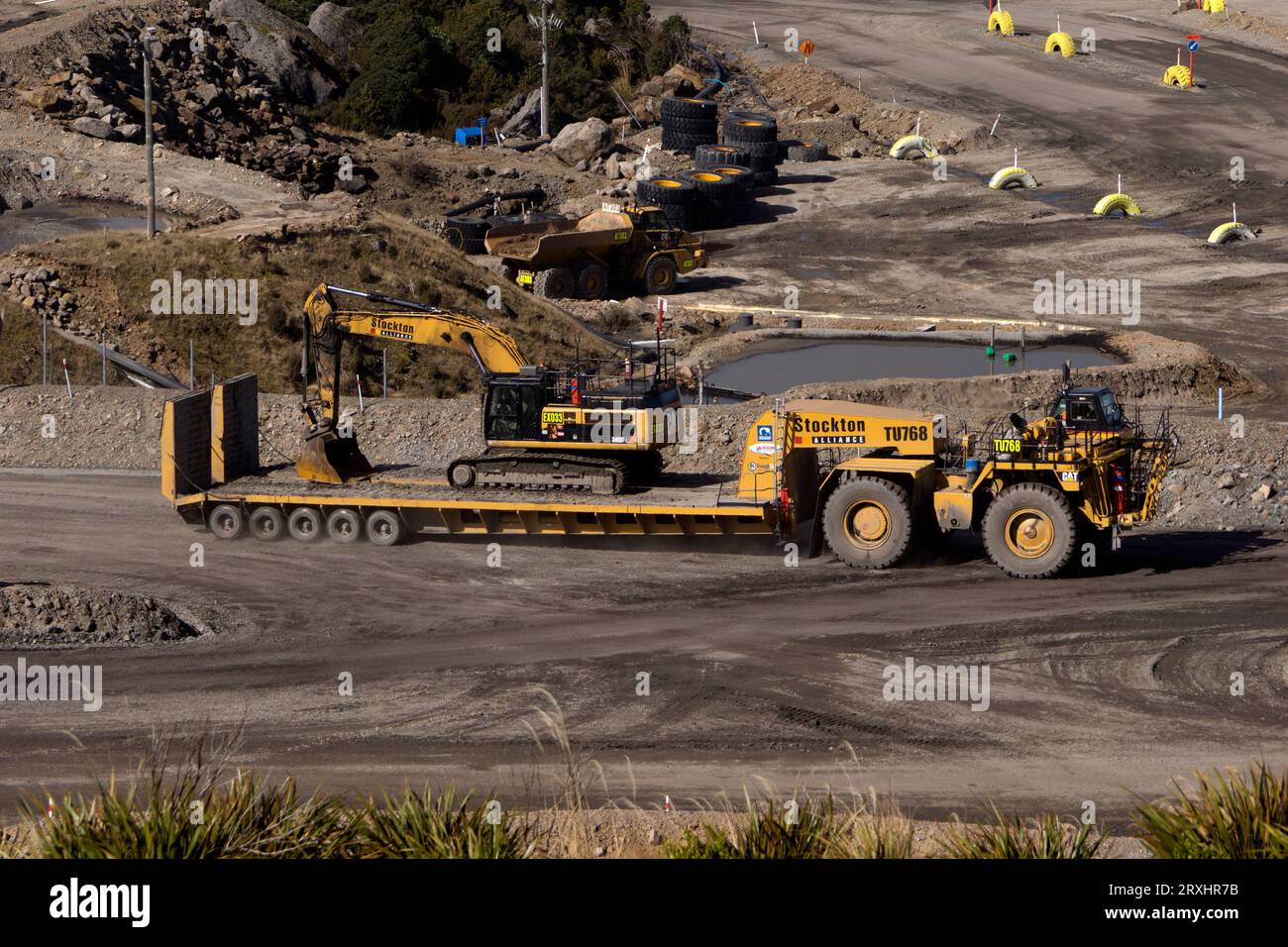 WESTPORT, NEW ZEALAND, AUGUST 31, 2013: a 40 ton digger hitches a ride ...