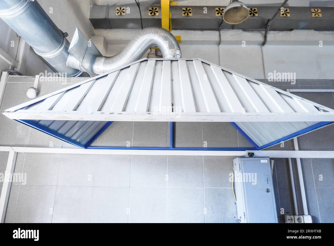 Industrial hood in production workshop. Room ventilation system ...