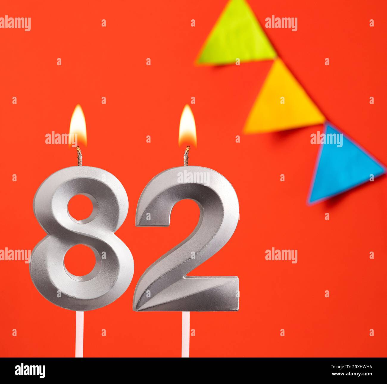 Birthday card - Number 82 candle in orange background Stock Photo - Alamy