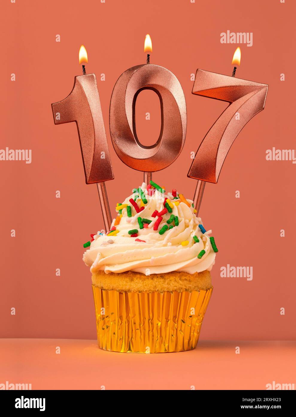 Birthday cake with candle number 107 - Coral fusion background Stock ...
