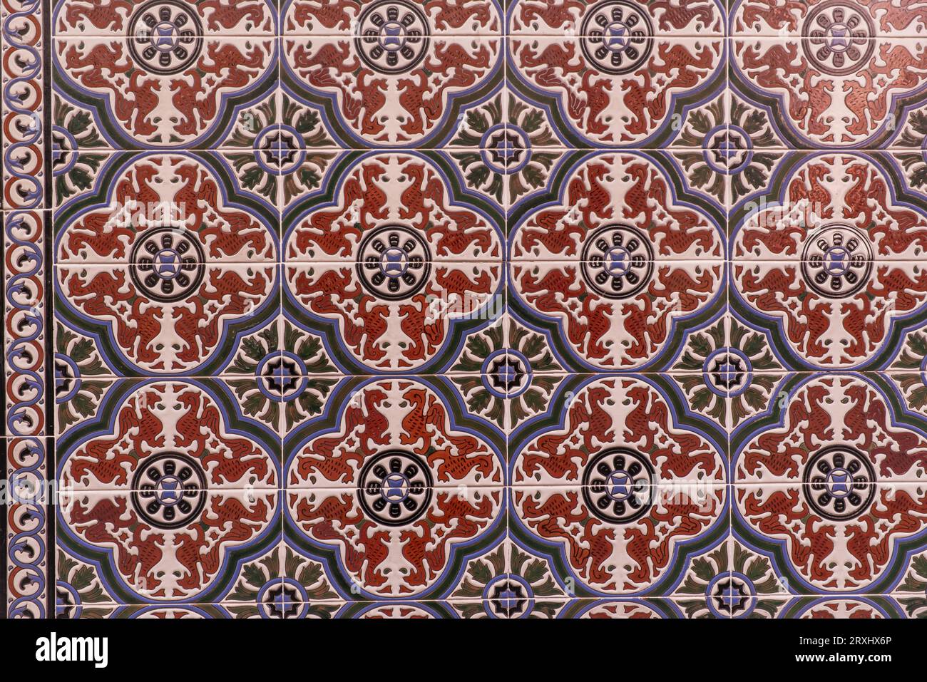 Some colorful tiles with symmetrical shapes in colors, red, blue, white ...
