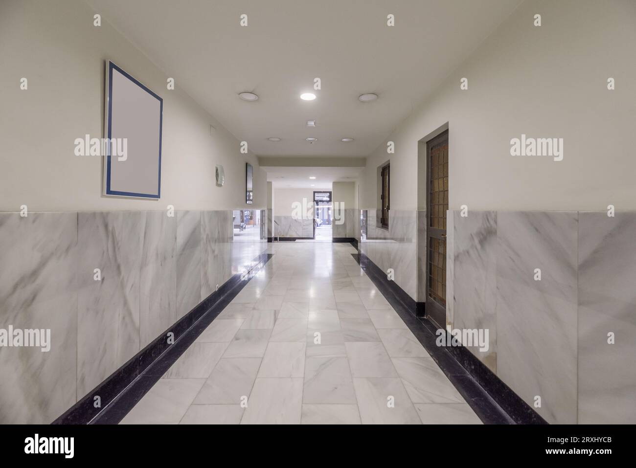 Access portal to a residential building with marble coating on walls ...