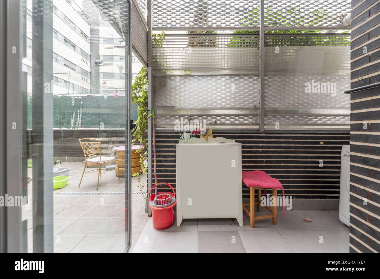 Glazed terrace of a ground floor home with access to an open terrace ...