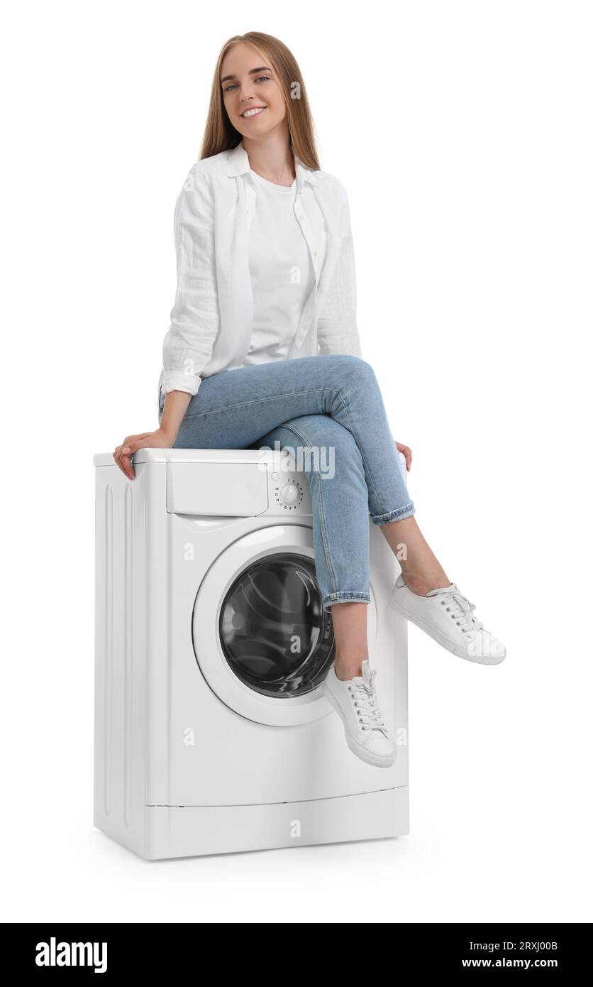 Beautiful young woman on washing machine against white background Stock ...