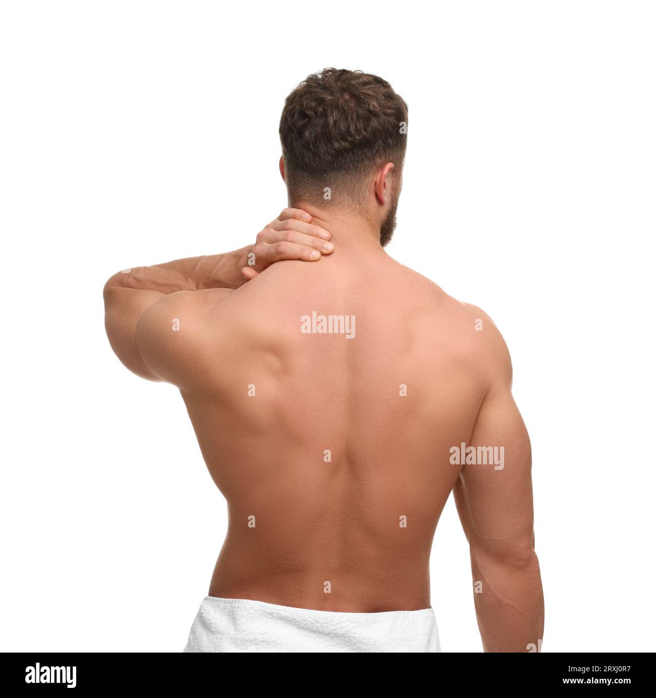 Man suffering from neck pain on white background, back view Stock Photo ...