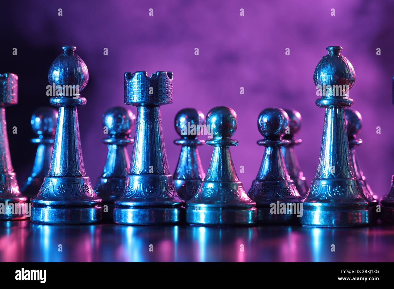 Chess pieces on checkerboard in color light Stock Photo - Alamy