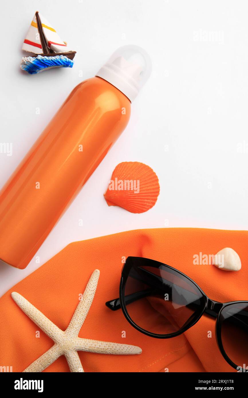 Flat lay composition with bottle of sunscreen on white background Stock ...