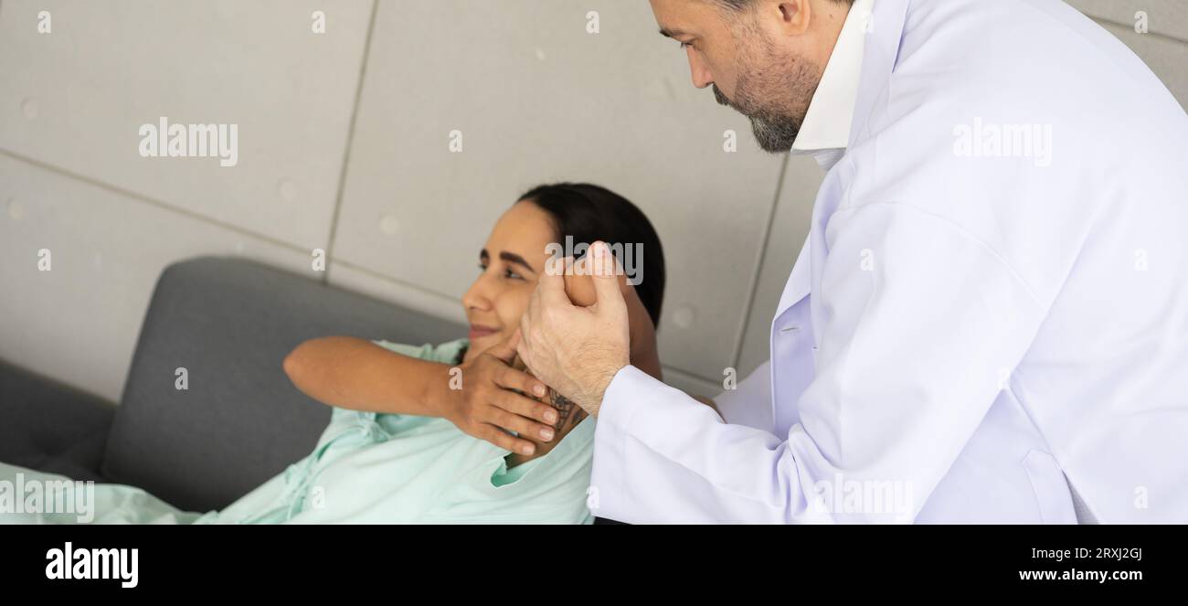 Caucasian doctor working as physiotherapist for stretching and ...