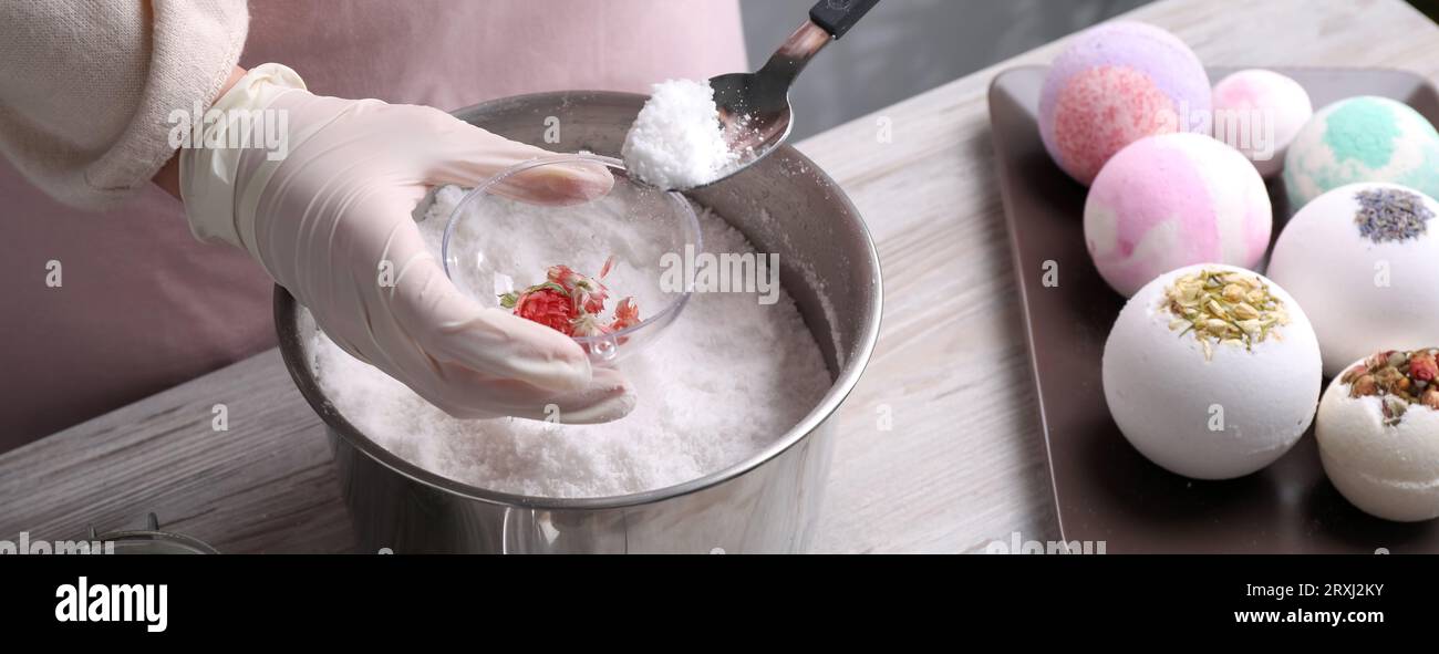 Woman making bath bomb at table, closeup. Banner design Stock Photo - Alamy