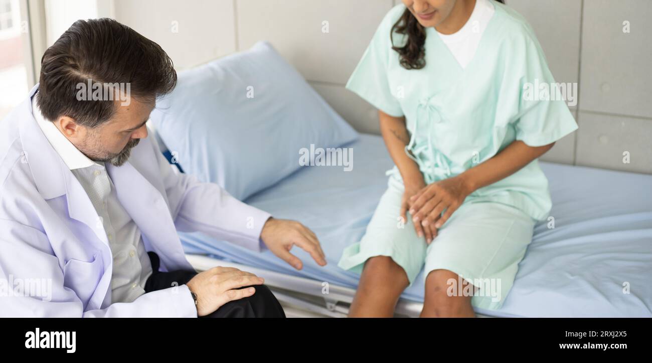 Caucasian male physician diagnosis for root cause finding with Hispanic ...