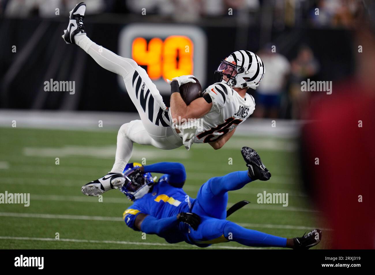 Cincinnati Bengals wide receiver Charlie Jones (15) is upended by Los ...