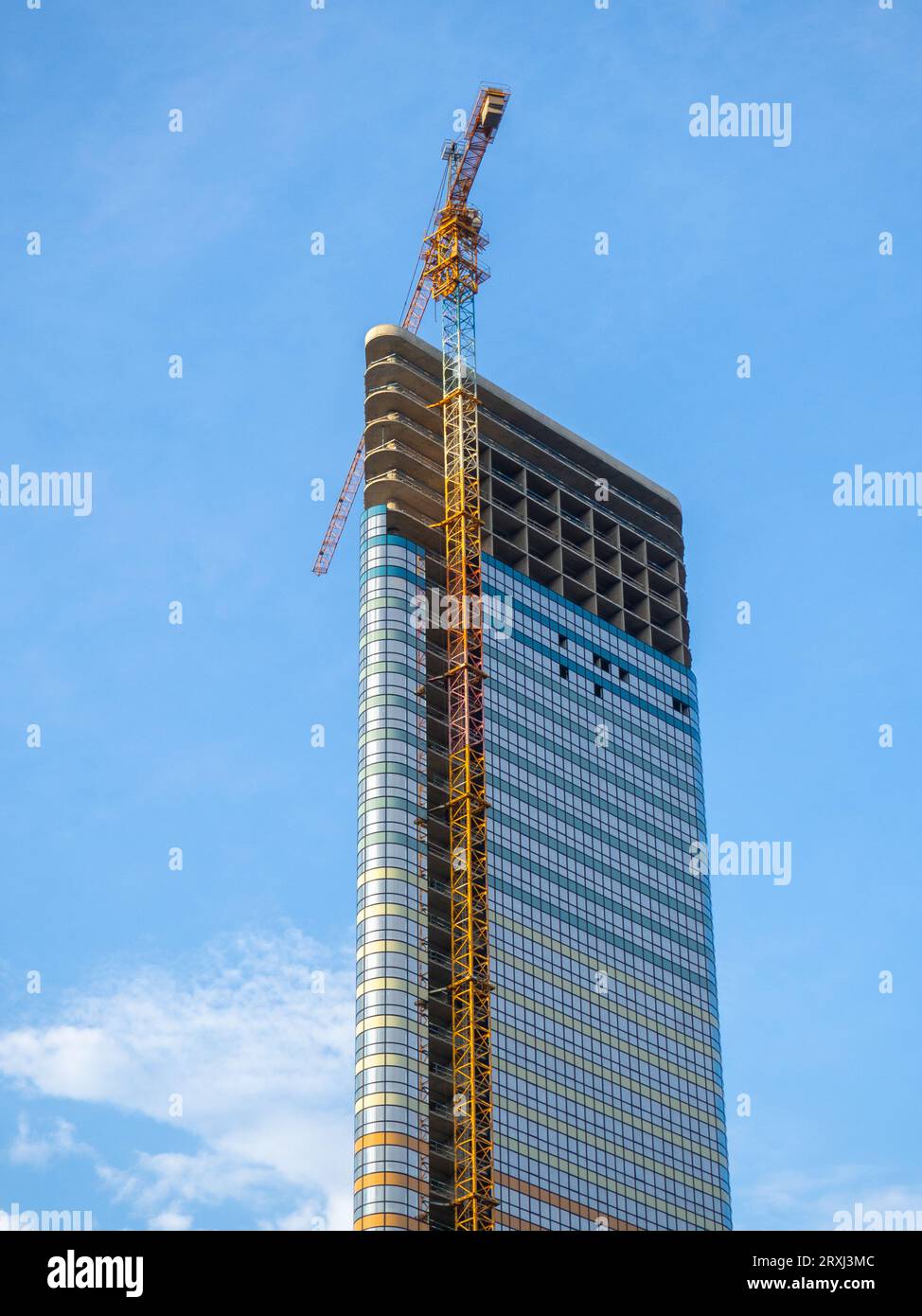 Construction of a high-rise building. Skyscraper glazing. Modern ...