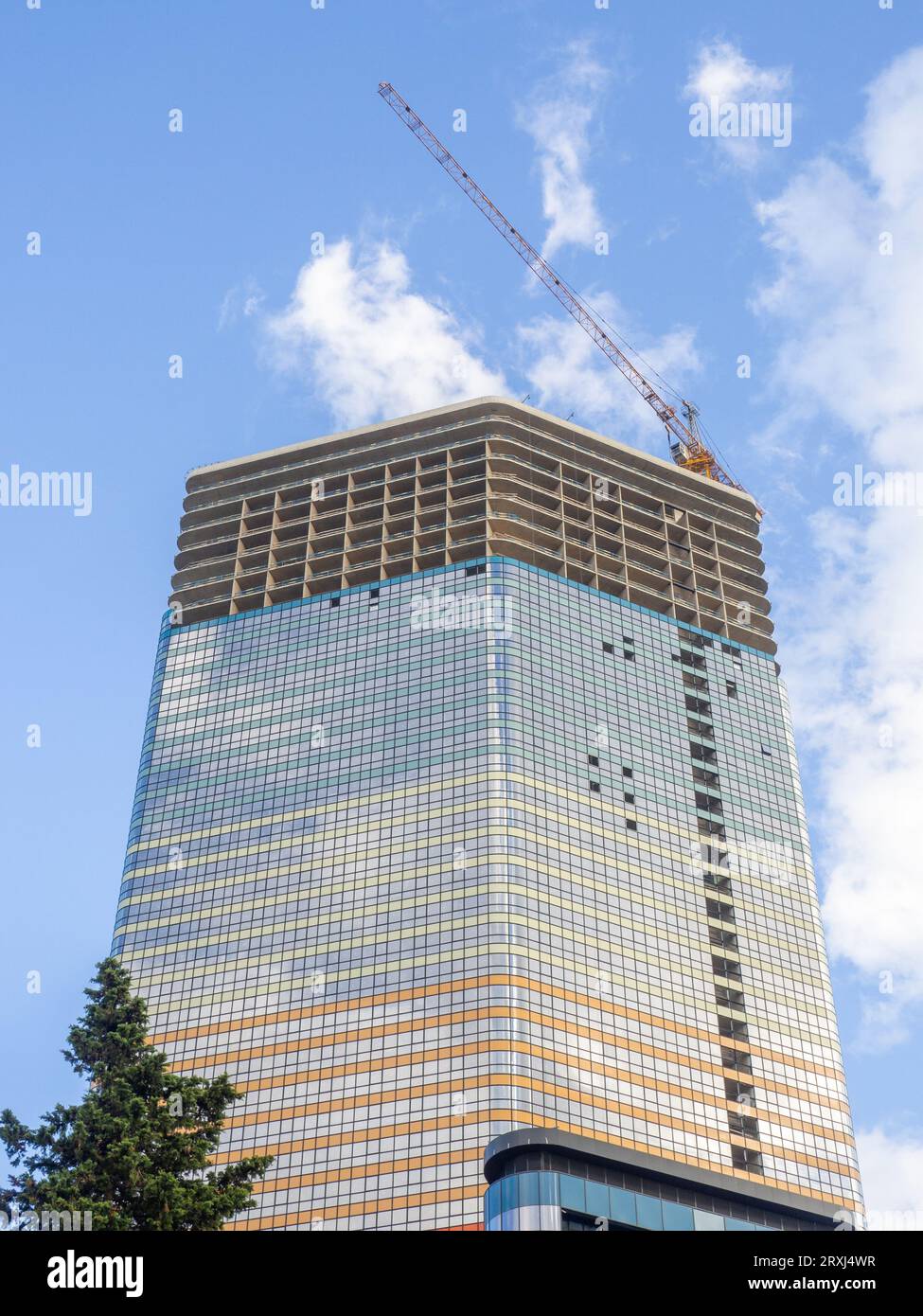 Construction of a high-rise building. Skyscraper glazing. Modern ...