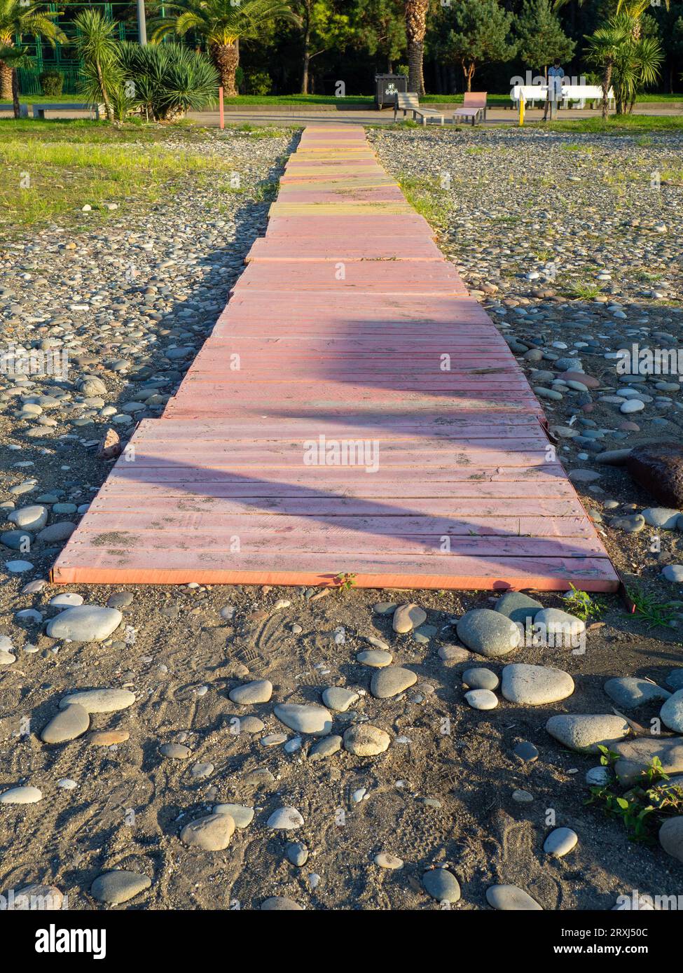 Flooring made of colored boards on the beach. Convenience at the resort ...