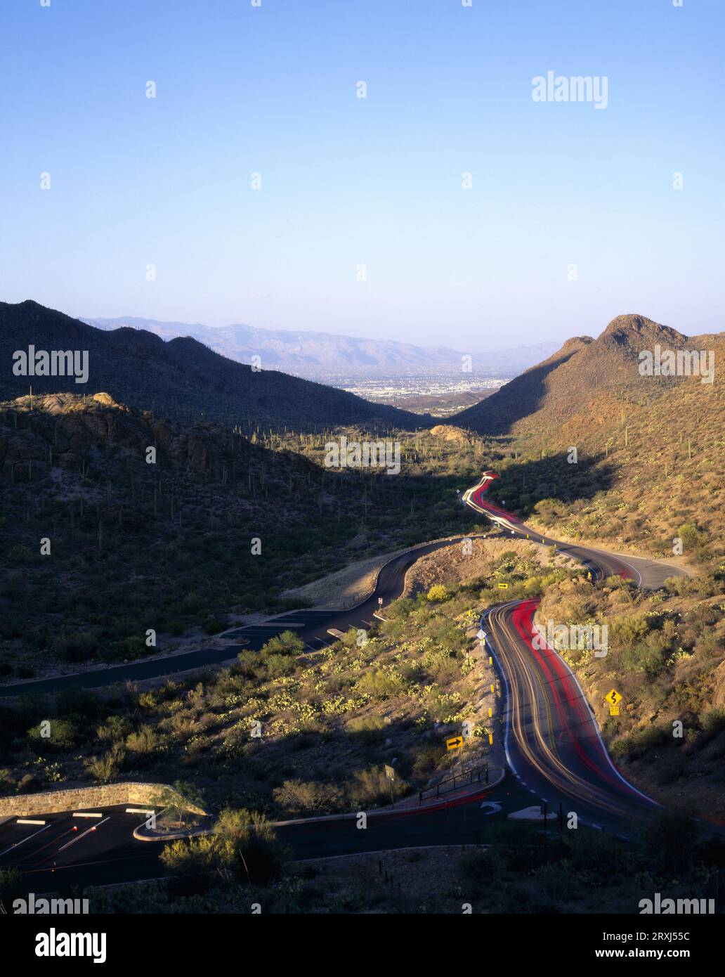 Cars travel along Gates Pass Road on the west side of Tucson, Arizona ...