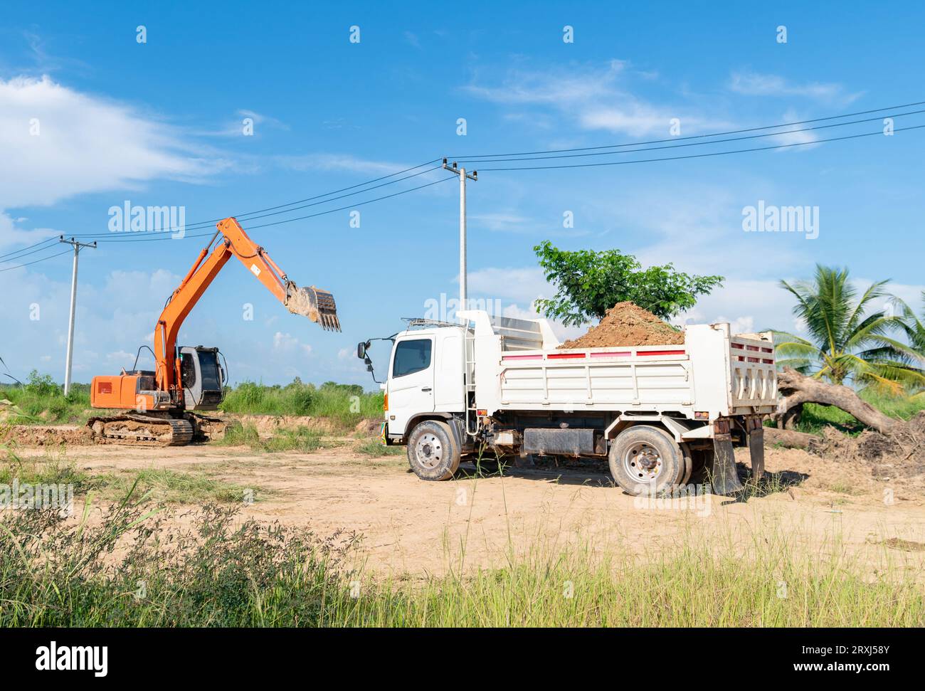 Digger and dumper truck under blue sky site in the construction ...