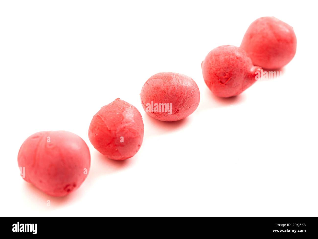 Red Freeze Dried Saltwater Taffy on a White Background Stock Photo - Alamy