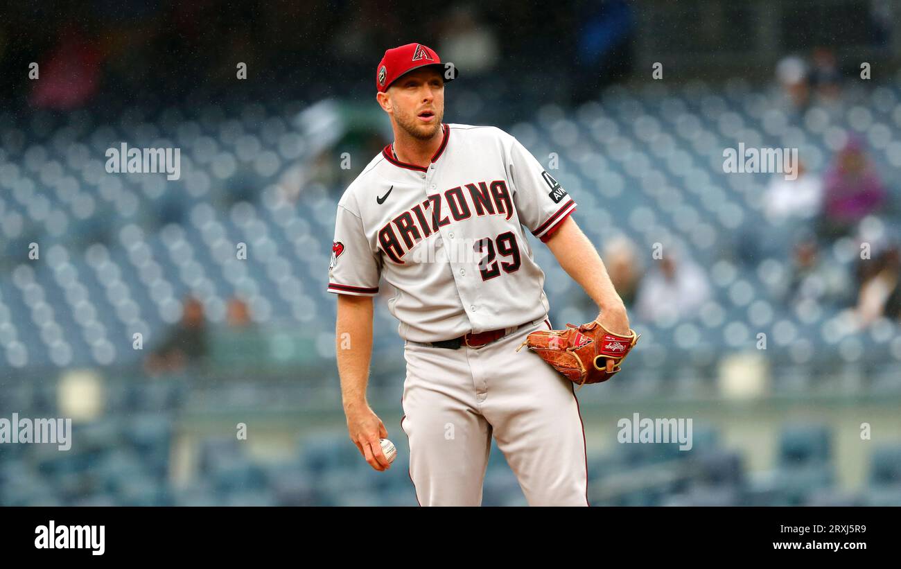 Arizona Diamondbacks starting pitcher Merrill Kelly (29) pauses before ...
