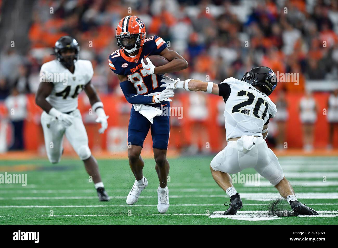 Syracuse wide receiver Donovan Brown (87) avoids a tackle by Army defensive back Casey Larkin ...