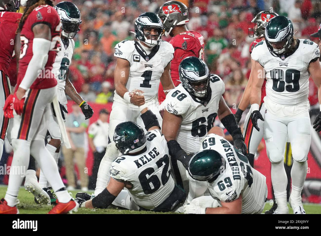 Philadelphia Eagles strains to help up Philadelphia Eagles center Jason ...