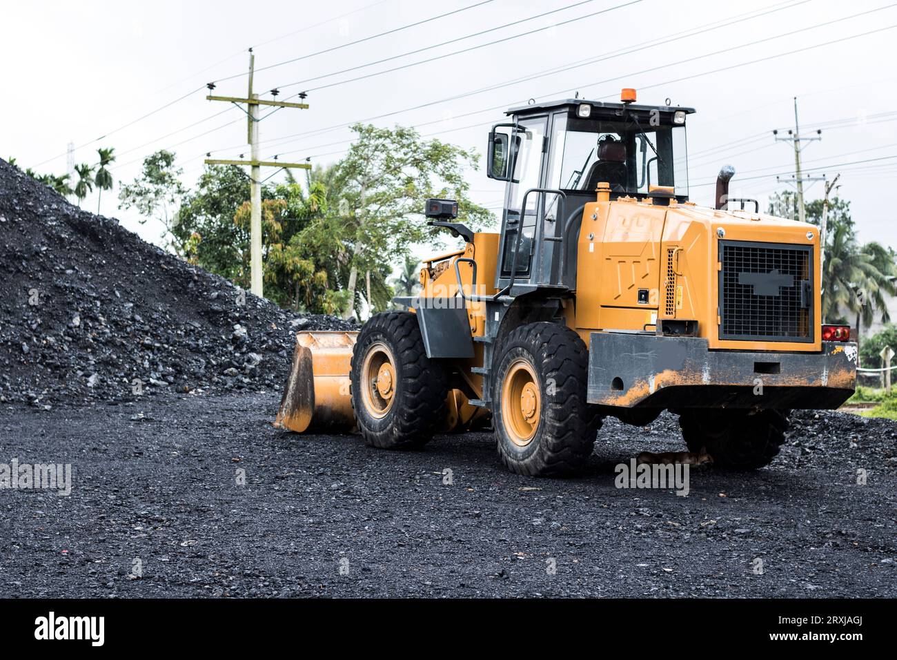 Construction of heavy equipment on the site on a coal dump, Excavator ...