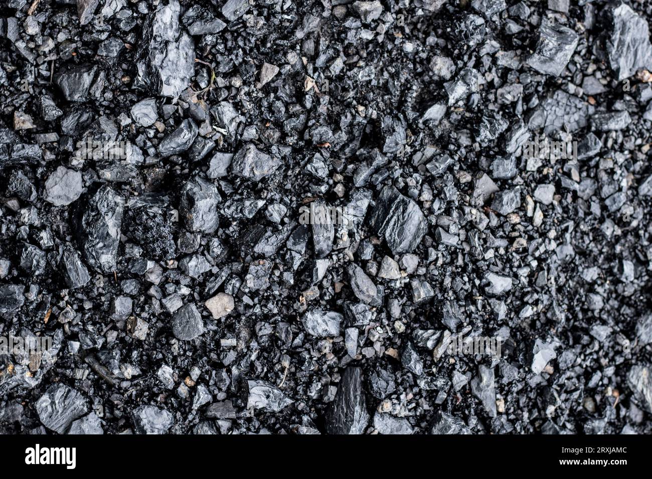 Black coal stones and pebbles from a coal store, Texture background for design, Coal stone ...