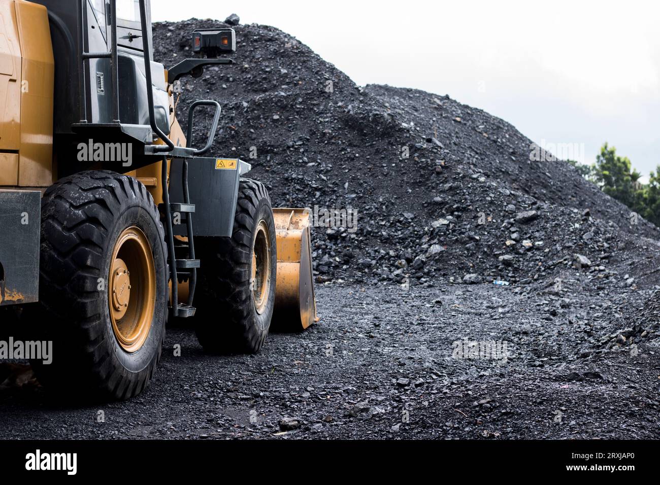 Construction of heavy equipment on the site on a coal dump, Excavator ...