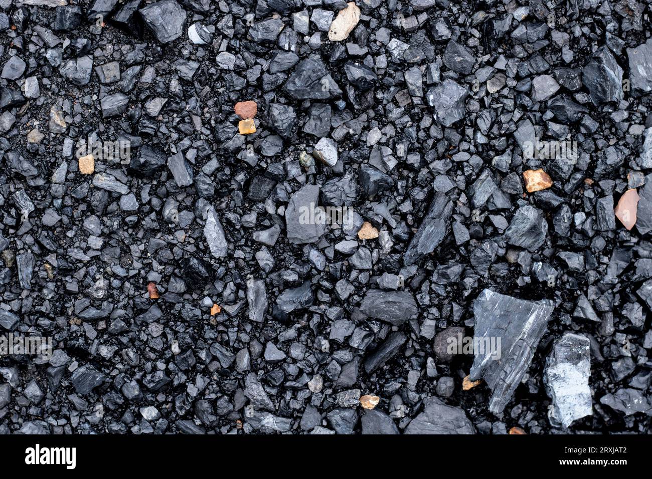 Black coal stones and pebbles from a coal store, Texture background for design, Coal stone ...