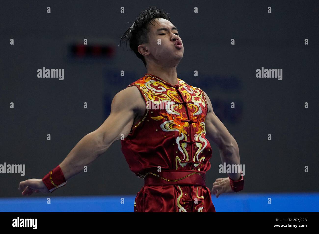 Macau's Chan Chi Ngou performs in the Wushu Men's Nanquan competition ...