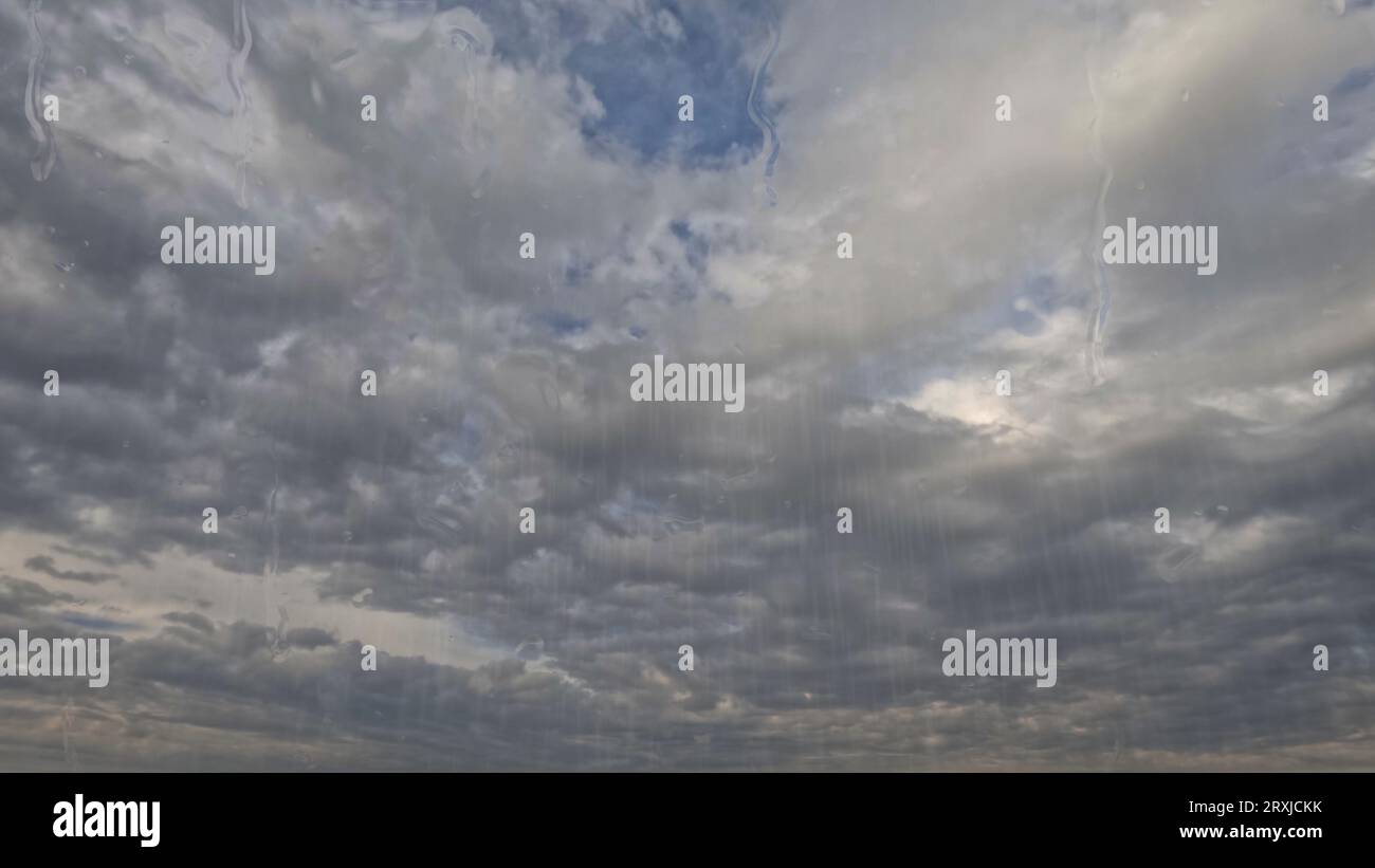 rainfall on sky with clouds - pretty weather bg - photo of nature Stock ...
