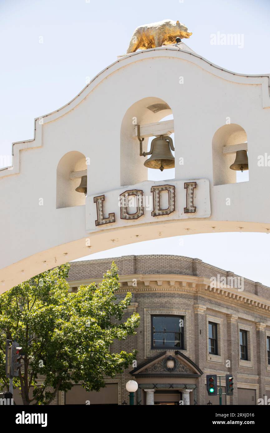 Lodi, California, USA - July 16, 2021: Afternoon sunlight shines on the historic bell arch way ...